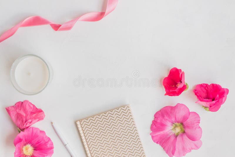 Flat Lay Desk with Pink Flowers, Notebook and White Heart Stock Image ...