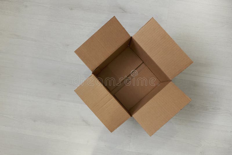 Flat Lay of Empty Open Cardboard Box on Wooden Surface Stock Image ...