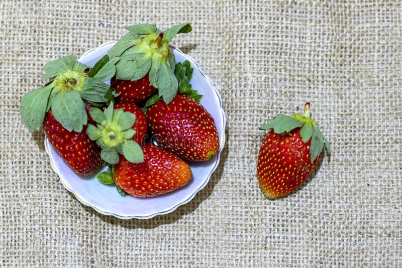 Flat Lay of Fresh Ripe Strawberries on a White Plate on Burlap ...
