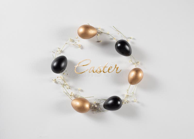 Flat Lay of Golden and Black Easter Eggs Ring Circle on White ...