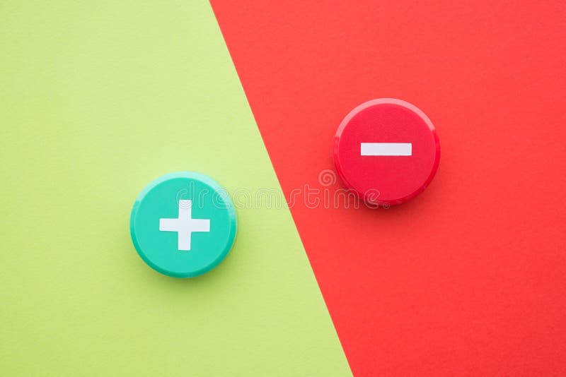 Flat Lay of Green Plus and Red Minus Symbol Plastic Button on Green and ...