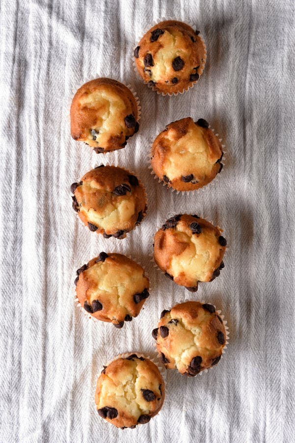 Flat Lay of a Group of Mini Chocolate Chip Muffins on a Kitchen Towel ...