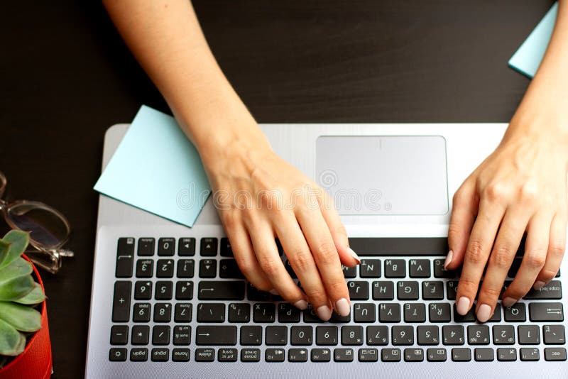 Flat Lay Hands of a Programmer at Work on a Laptop. Black Office Desk ...