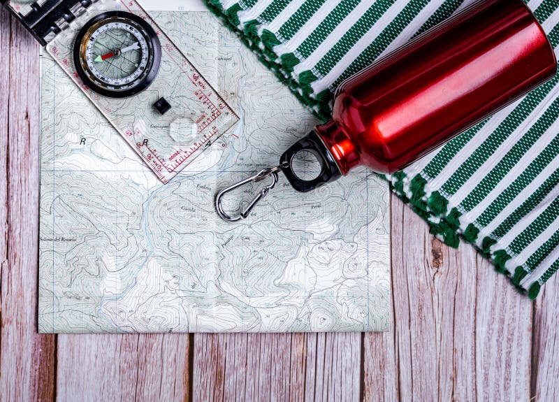 Flat Lay of Hiking Equipment - Map, Bottle, and Compass Stock Photo ...