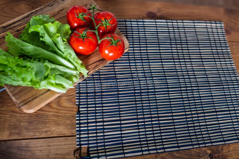 Flat Lay. Kitchen Table with Lettuce and Red Tomatoes Stock Image ...