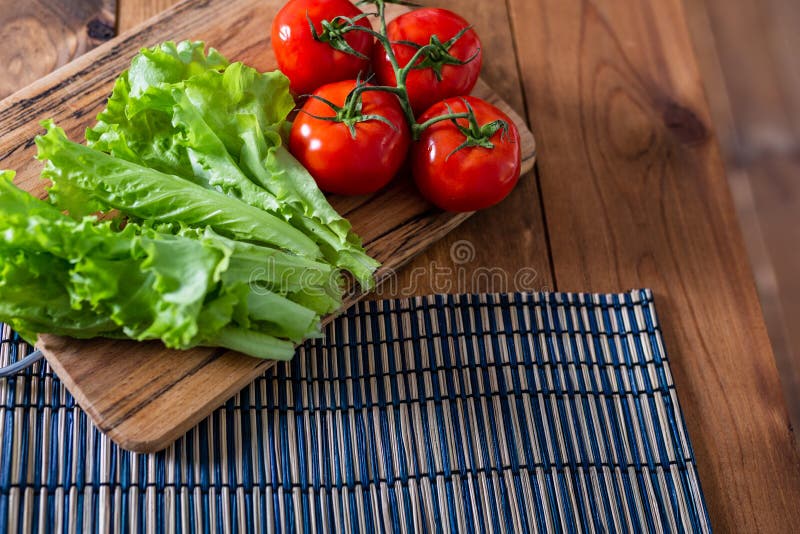 Flat Lay. Kitchen Table with Lettuce and Red Tomatoes Stock Image ...