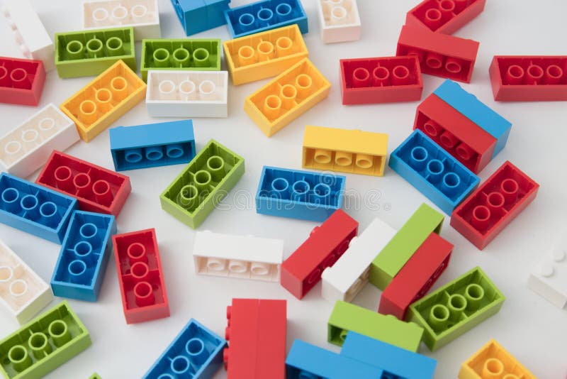 Flat Lay of Many Assorted Colored Plastic Building Blocks on a White ...