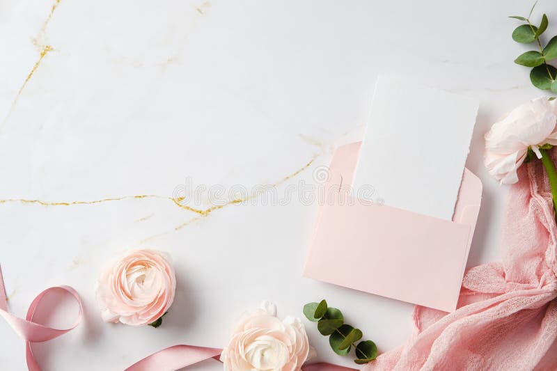 Flat Lay of a Pink Envelope, Blank Card, Pink Roses, Eucalyptus, and ...