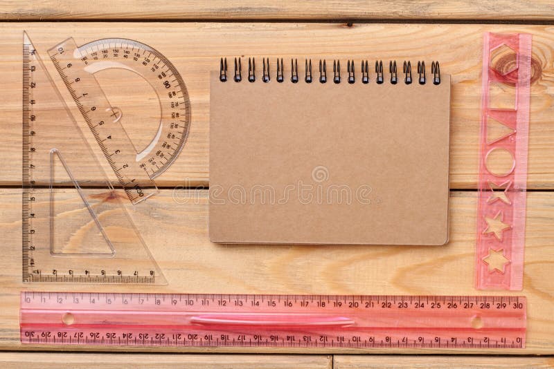 Flat Lay of Plastic Rulers and Spiral Notebook. Stock Photo - Image of ...