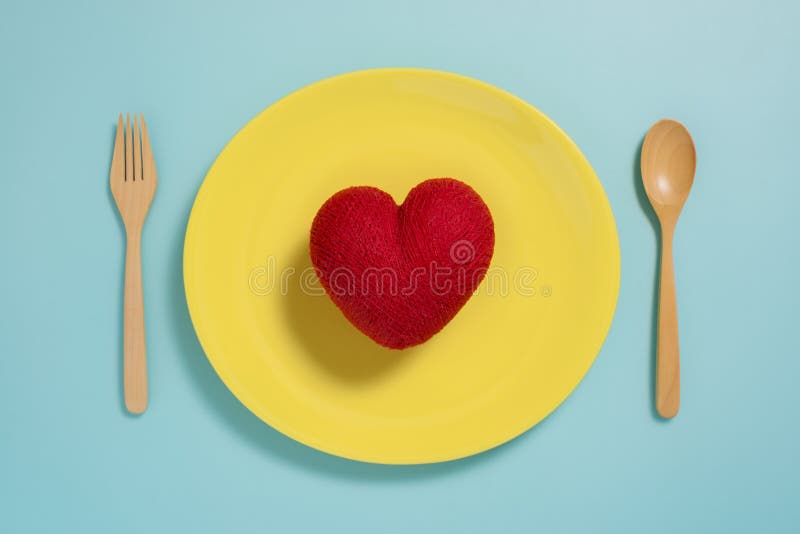 Flat Lay of Red Heart on Yellow Plate with Fork on Pastel Blue Color ...
