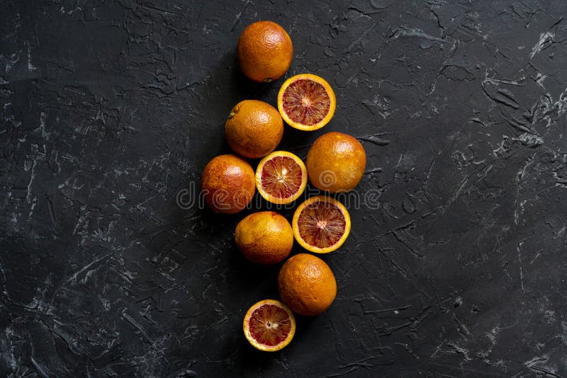 Flat Lay of Red Sliced Exotic Oranges, Dark Food on Black Surfaces ...