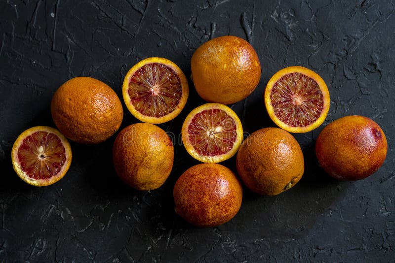 Flat Lay of Red Sliced Exotic Oranges, Dark Food on Black Surfaces ...