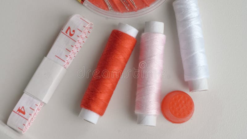 Flat Lay of Sewing Tools Including Threads, Pins and Measure Tape for ...