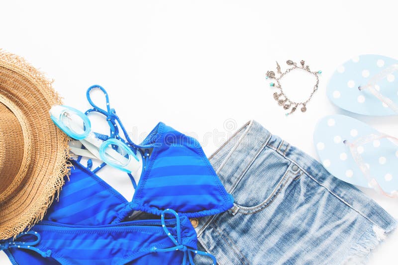 Flat Lay of Bikini and Accessories with Fern Leaves on Green Background ...