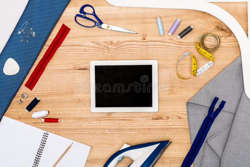 Digital Tablet and Tailoring Items on Table Stock Image - Image of ...