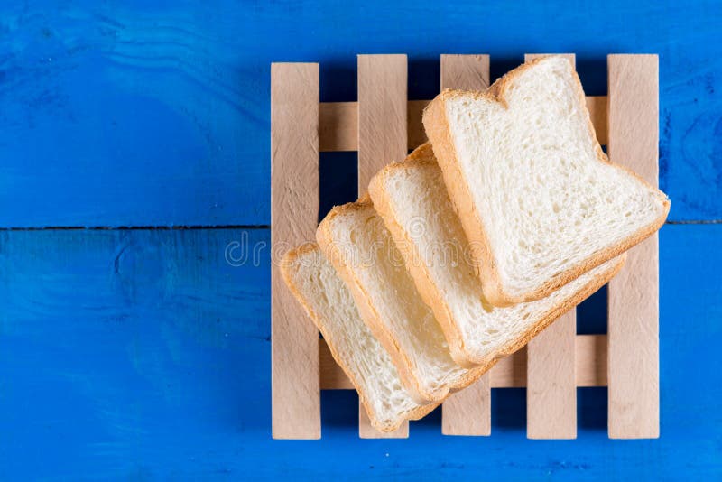 Flat Lay Toast Bread on the Blue Wooden Planks Board Stock Photo ...