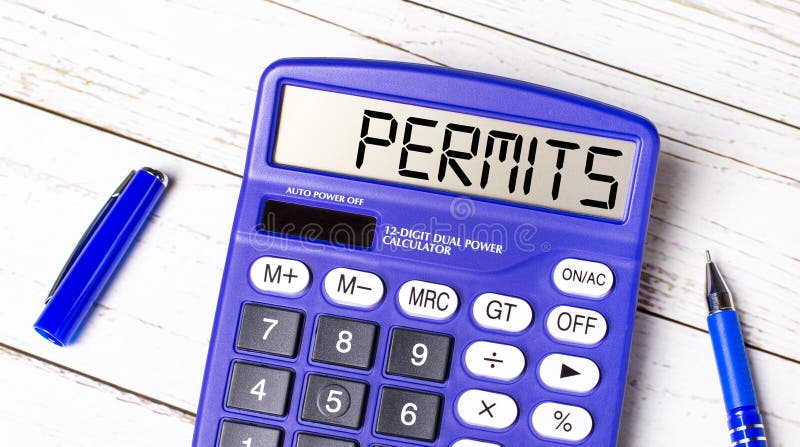Flat Lay or Top View of Blue Pen and Calculator with PERMITS Text on ...