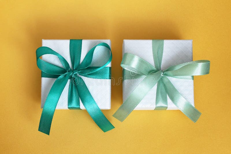 Flat Lay on Two Elegant Gift Boxes Tied with Emerald Green Ribbons on a ...
