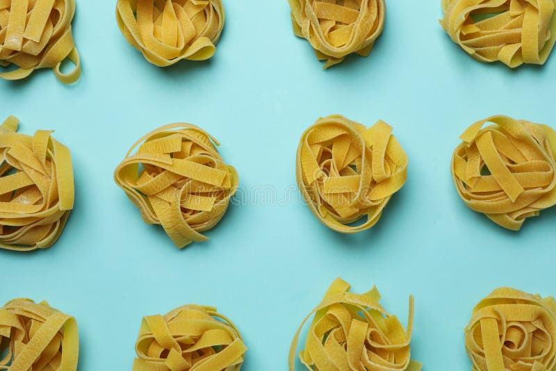 Flat Lay with Uncooked Pasta on Blue Background Stock Photo - Image of ...
