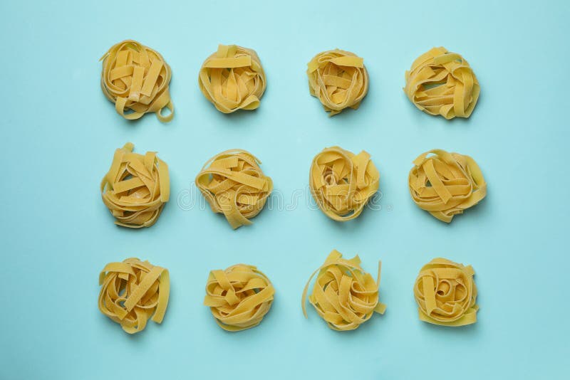 Flat Lay with Uncooked Pasta on Blue Background Stock Photo - Image of ...