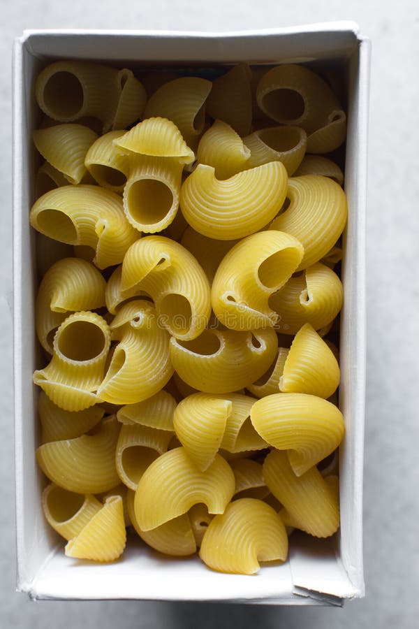Flat Lay of Uncooked Pipe Rigate Pasta in a Box, Top View of Pipe ...