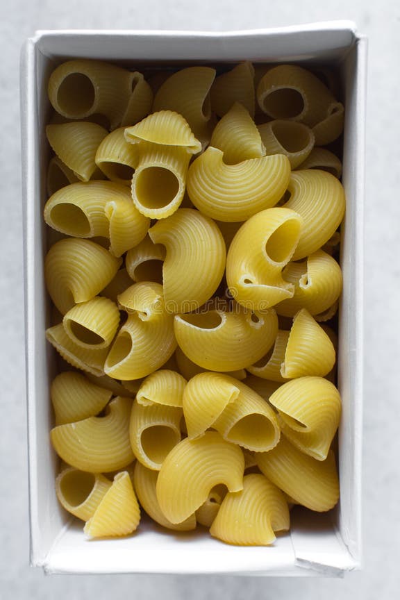 Flat Lay of Uncooked Pipe Rigate Pasta in a Box, Top View of Pipe ...