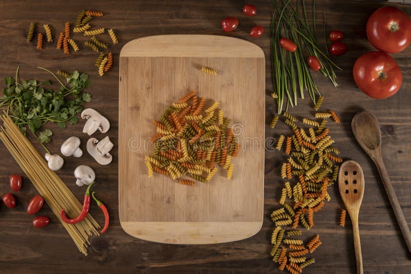 Flat Lay of Vegetables and Pasta and a Chopping Table Stock Photo ...