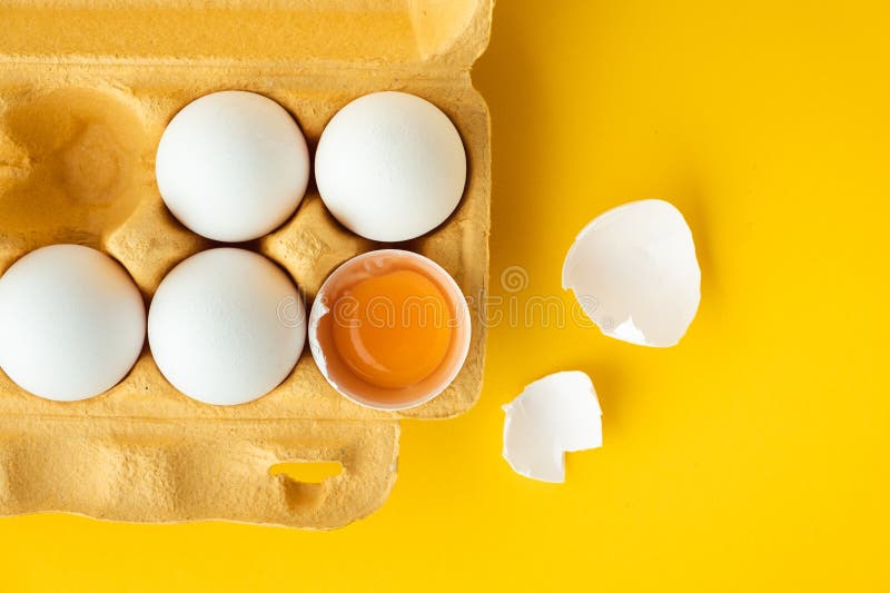 Flat Lay of White Eggs in the Carton Brown Box on the Yellow Background ...