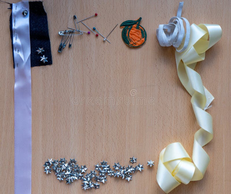 Flat Lay of a Wooden Table with a Tape, Pins, Needles, Stars, Etc Stock ...