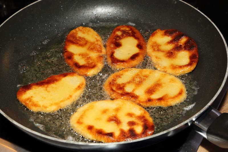 Flat Potato Dumplings Roasting in Hot Oil Stock Photo - Image of grease ...