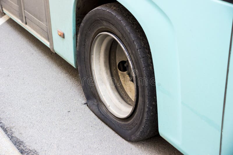 A Flat, Punctured Tire of a City Bus Stock Image - Image of vehicle ...