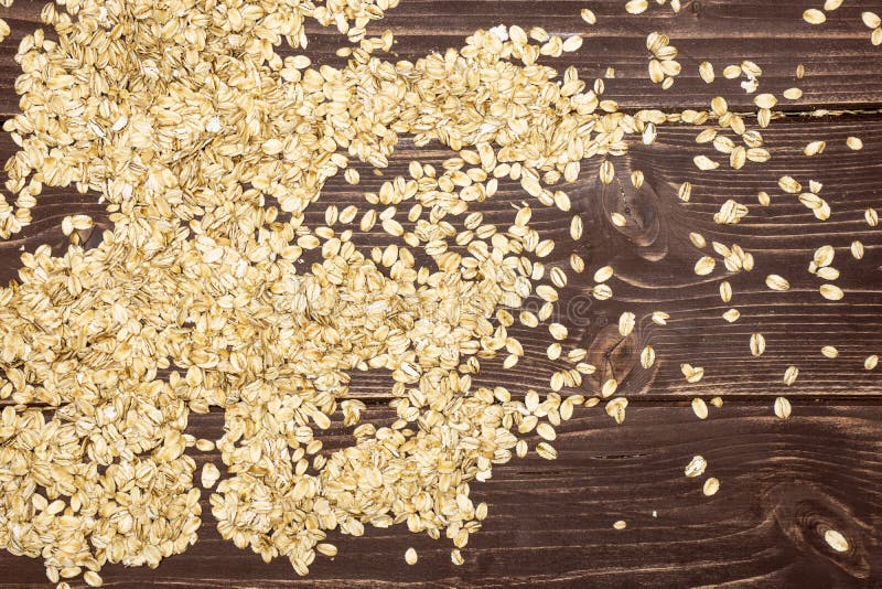 Flat Raw Rolled Oats on Brown Wood Stock Image - Image of close ...