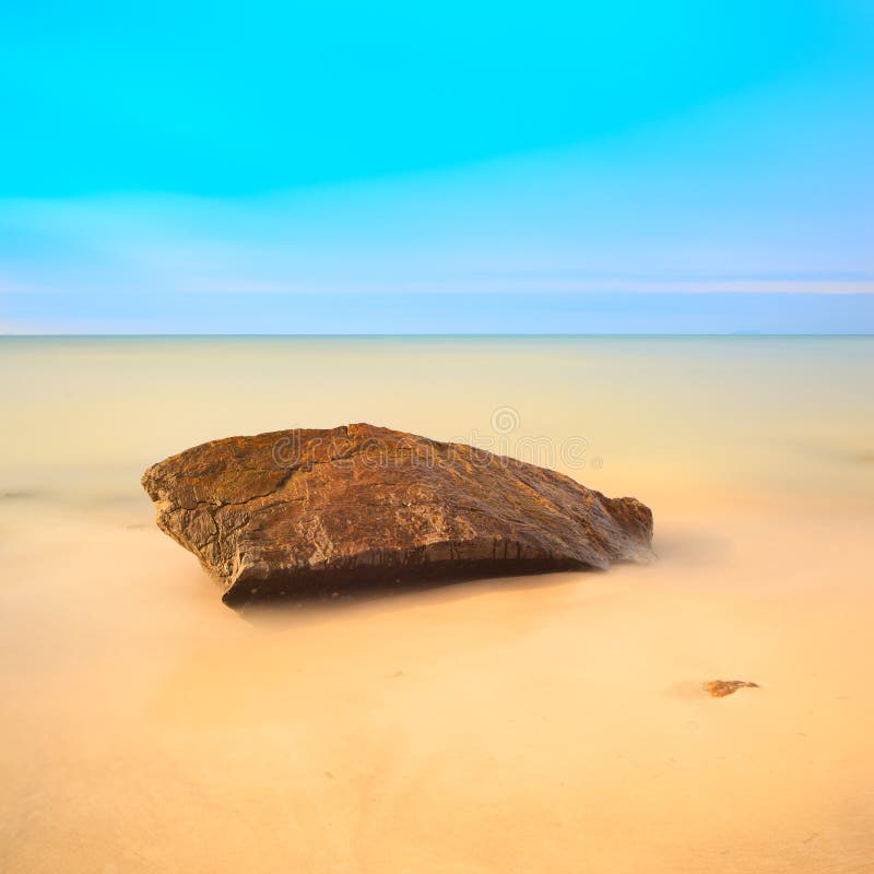 Flat Rock on a Golden Beach. Long Exposure. Stock Photo - Image of sand ...