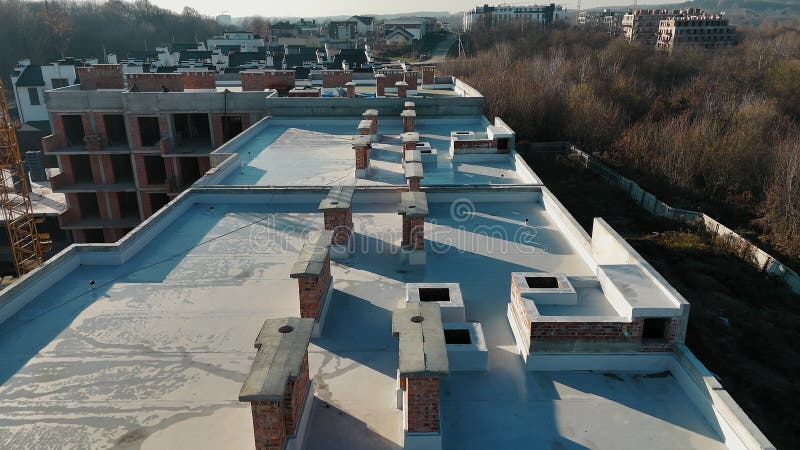 Flat Rooftop of Unfinished Building with Brick Chimneys, Aerial View of ...