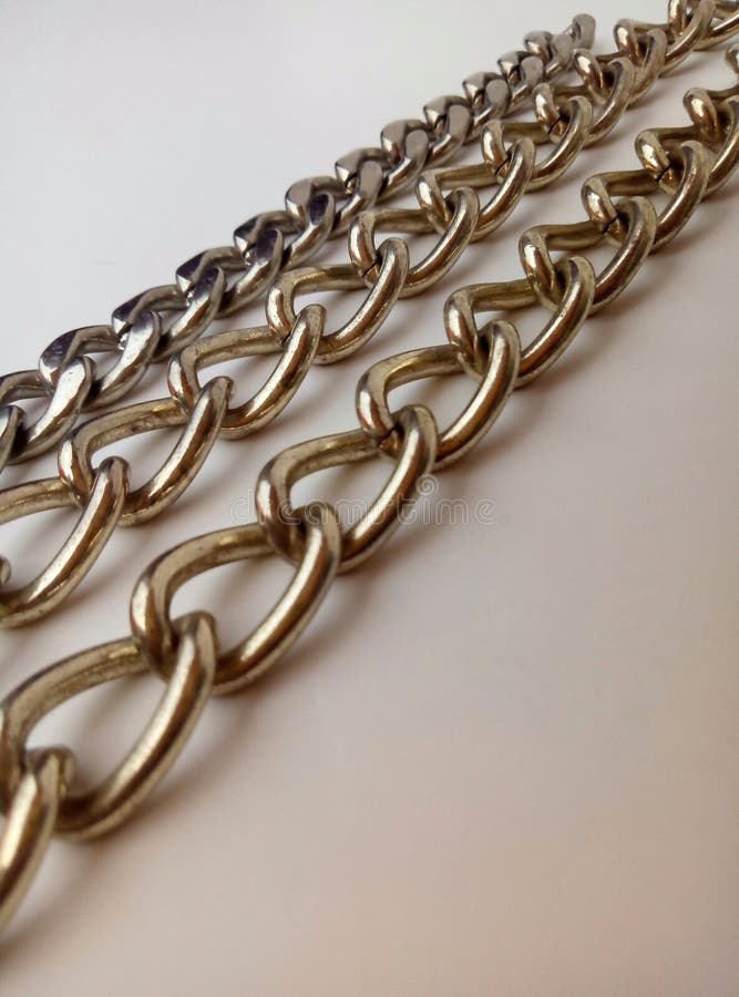 Flat and Round Chains Lined Against an Isolated White Background Stock ...
