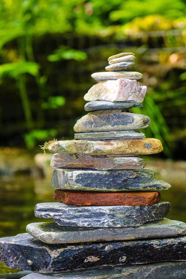 Stack of Stones Piled Up in Forest Setting Stock Photo - Image of ...
