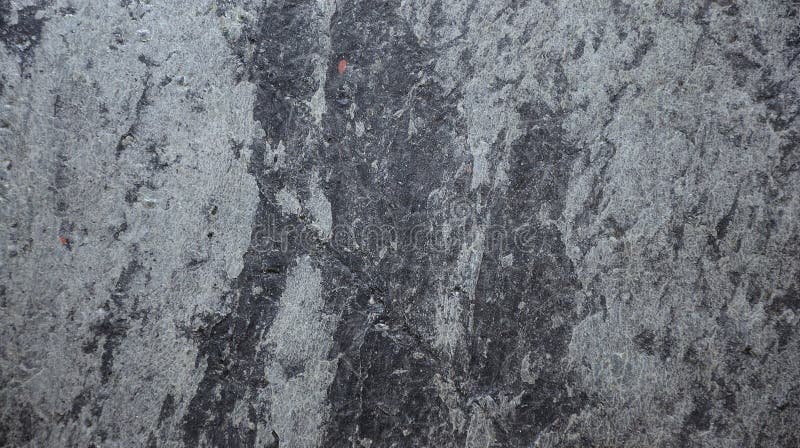 The Flat Surface of a Roughly Worked Black Natural Stone with Veins of ...