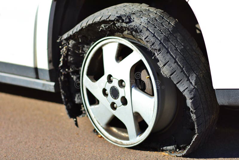 FLAT TIRE - Rim on Asphalt stock image. Image of auto - 81884503