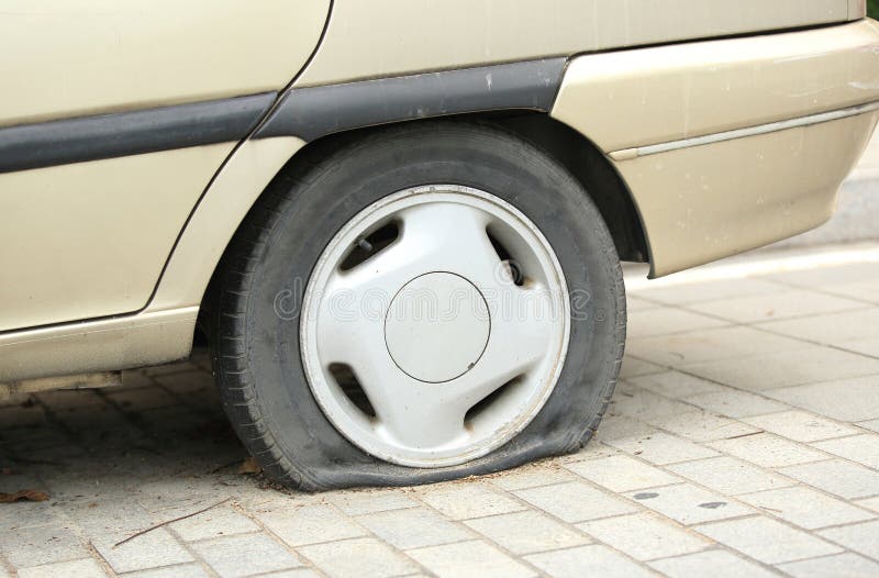 Flat tyre on car wheel stock image. Image of tyre, problem - 45084641