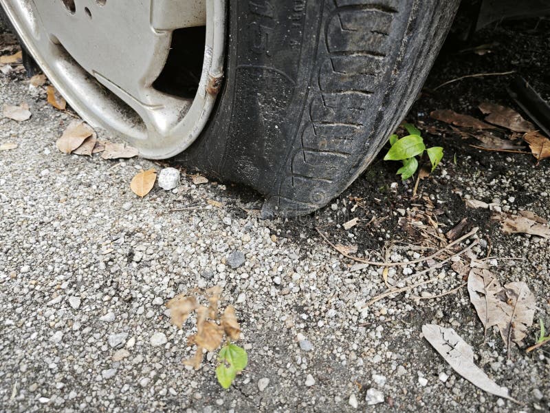 Flat Tyre Wheel by the Roadside. Stock Photo - Image of roadside ...