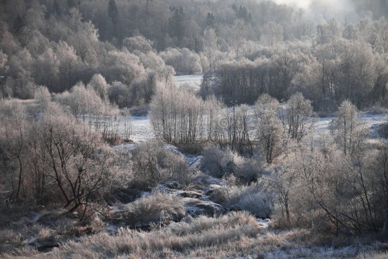 A Flat Valley Surrounded by Mountains with a Scattering of Large Stones ...