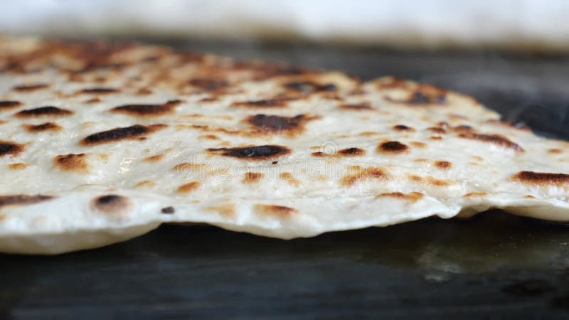 Delicious Flatbread Cooking on a Hot Griddle in an Outdoor Kitchen ...