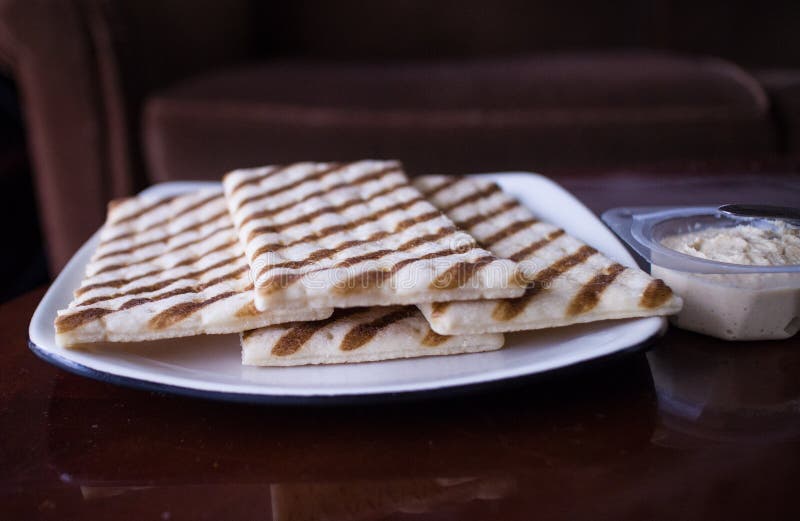 Flatbread on a white plate stock image. Image of eastern - 59423943