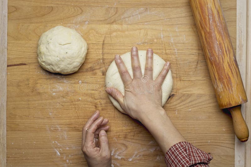 Flatlay of Pressing Down a Ball of Dough Stock Photo - Image of hand ...