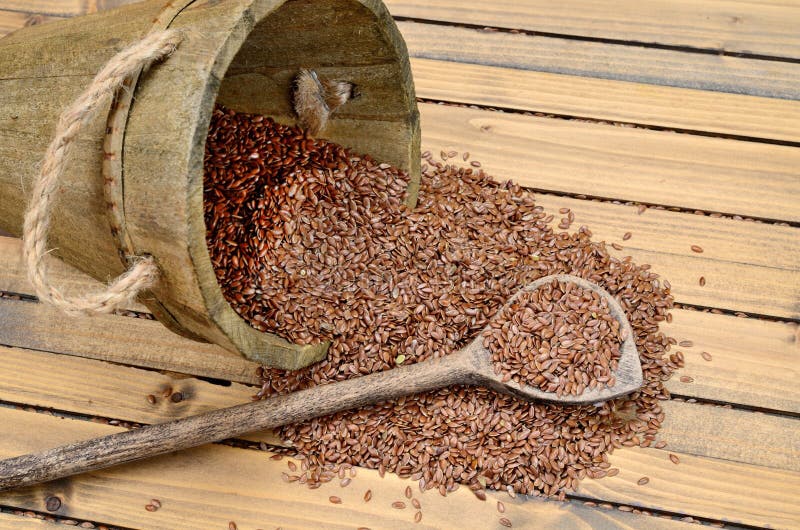Flax seed on table stock photo. Image of brown, bucket - 81957402