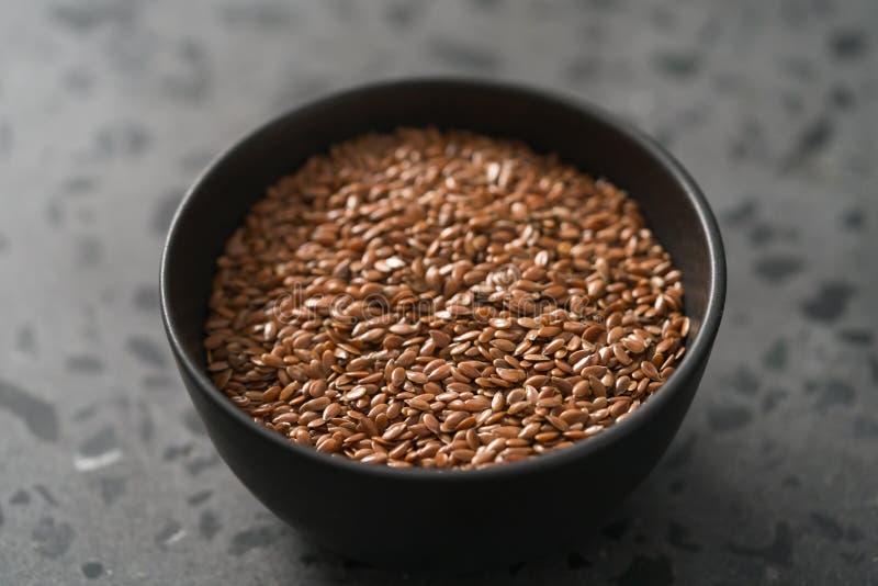 Flax Seeds in Black Bowl on Terrazzo Surface with Closeup Stock Photo ...