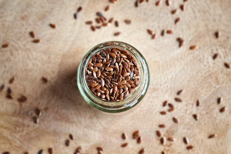 Fresh flax seeds in a jar stock image. Image of wooden - 238394303