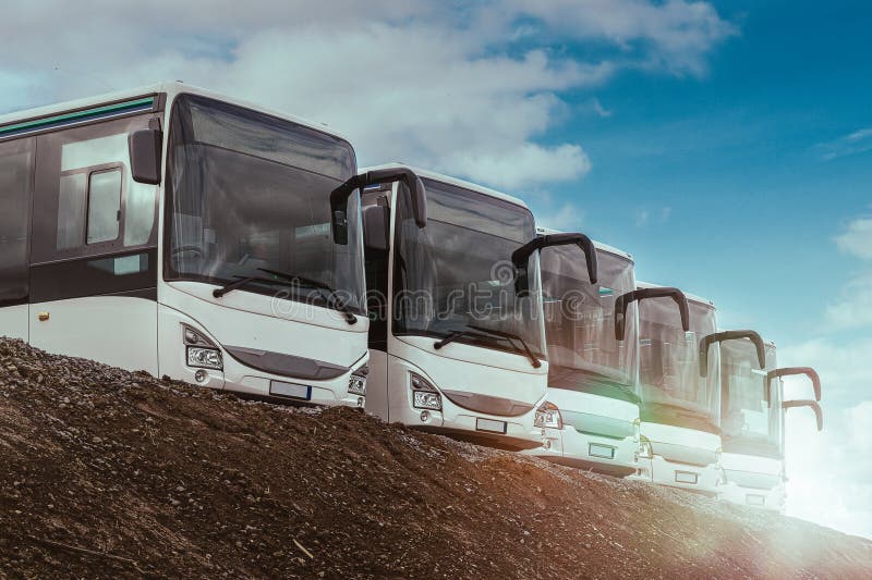 Fleet of Buses in a Row on a Hill in Bright Sunshine and Blue Sky Stock ...