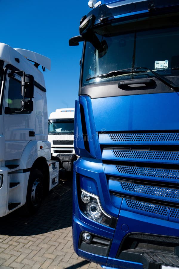 Fleet of white semi trucks stock image. Image of sale - 265948239