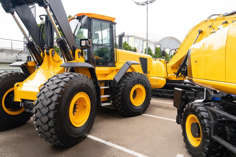 Fleet of Yellow Construction Machines Stock Photo - Image of excavation ...